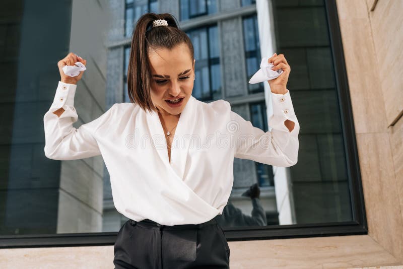 Business Lady with Anger Throws Papers in Different Directions Against ...