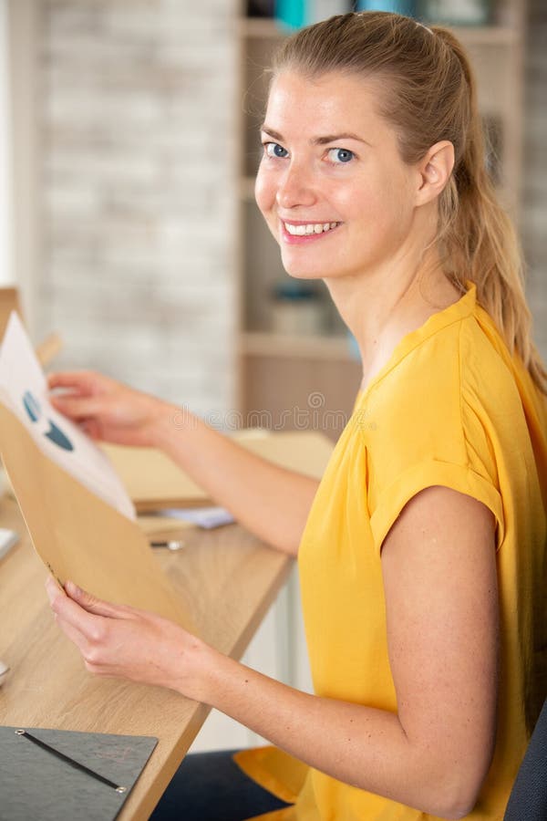 Business Lady Filling Envelope with Business Documents Stock Photo ...