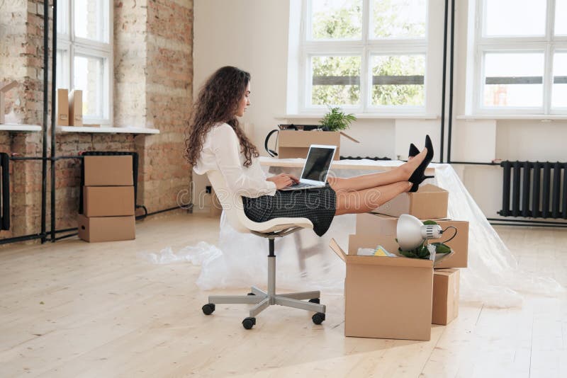 Business Lady Keeping Feet on Stack of Moving Boxes Stock Photo - Image ...