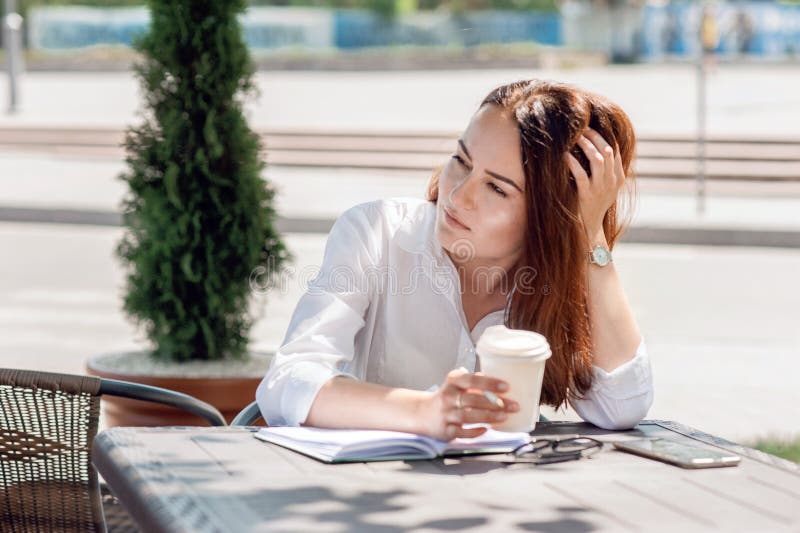 Business Lady with Notepad Drinking Coffee at Table in Cafe Stock Photo ...