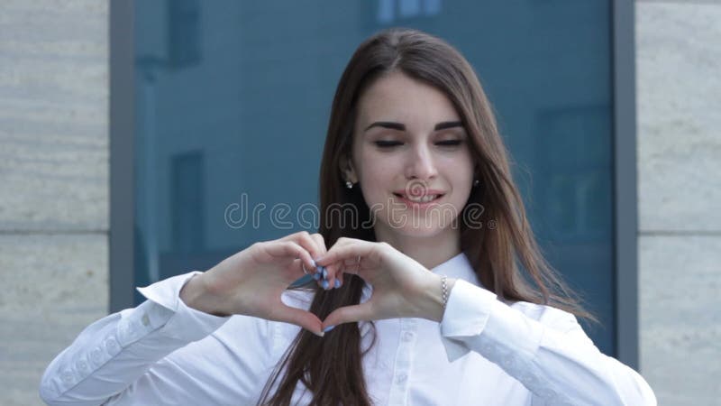 Business Lady Shows Hands Symbol of the Heart and Smiling Stock Video ...
