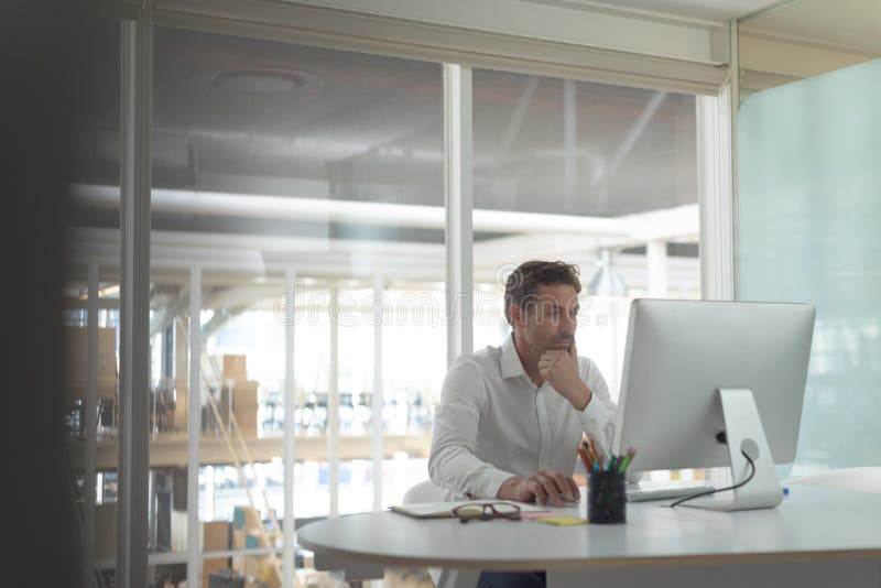 Business Male Executive Working on Computer at Desk in a Modern Office ...