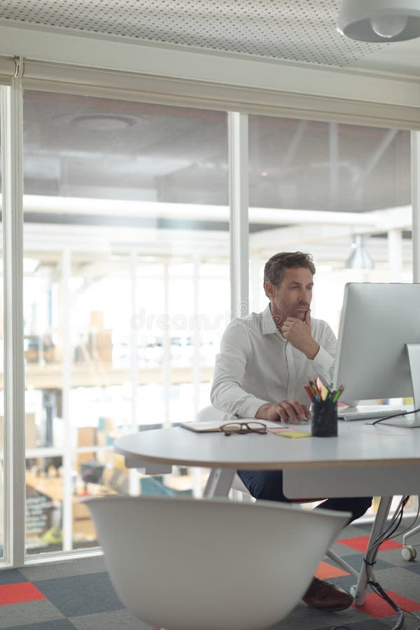 Business Male Executive Working on Computer at Desk in a Modern Office ...