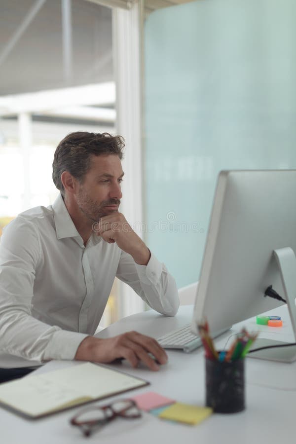 Business Male Executive Working on Computer at Desk in a Modern Office ...