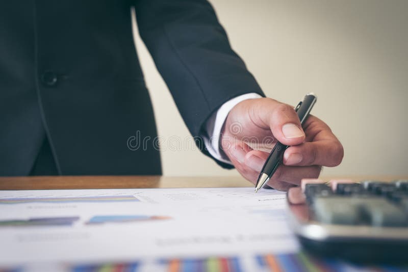 Business Man Analyzing Graph and Chart Document Report Stock Photo ...