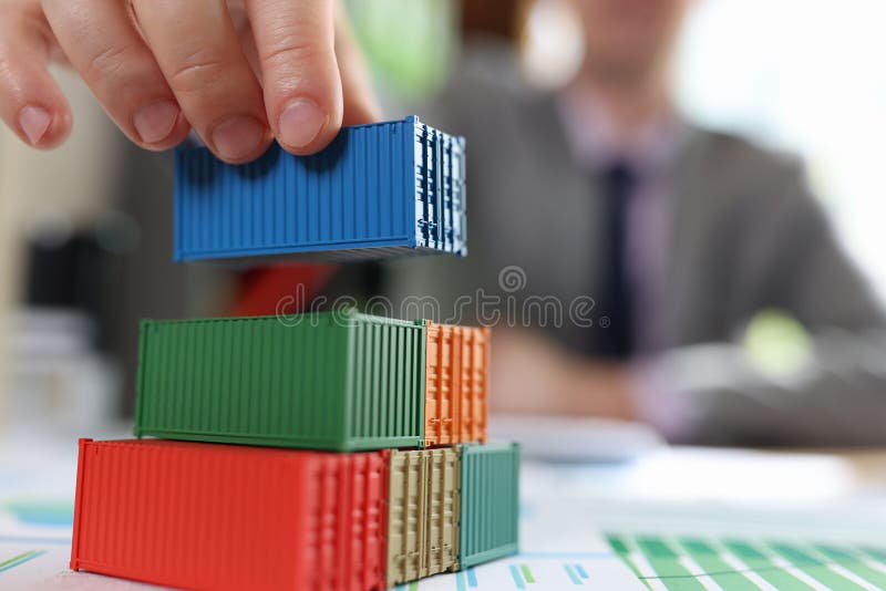 Business Man Arranging Stack of Freight Cargo Containers on Office Desk ...