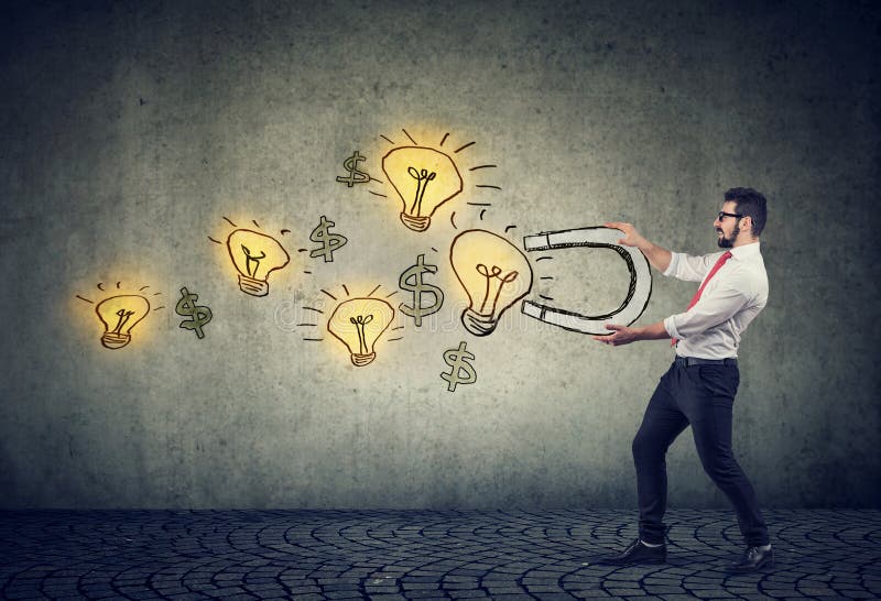 Business Man Attracts Bright Ideas Light Bulbs with a Magnet Stock ...