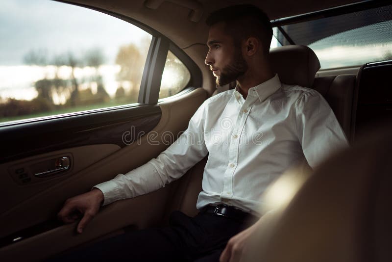 Man in Back Seat of Moving Car Stock Image - Image of office, person ...