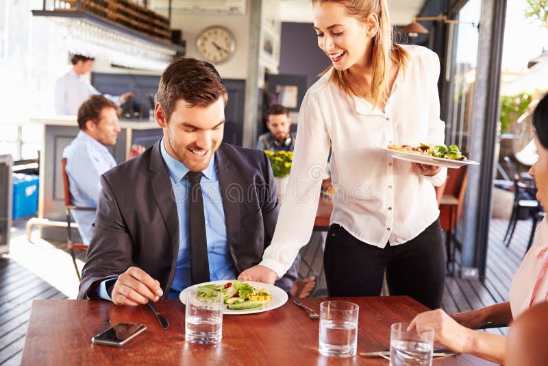 Business Man Being Served Food in a Restaurant Stock Photo - Image of ...