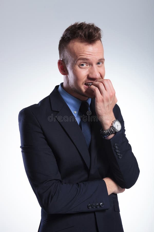 Businessman Biting His Lip and Making a Funny Scared Face Stock Photo ...