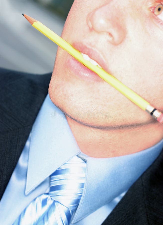 Business man biting pencil stock image. Image of metaphors - 1099063