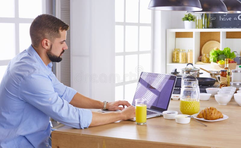 A Business Man Breakfasts with Notebook and Juice Stock Photo - Image ...