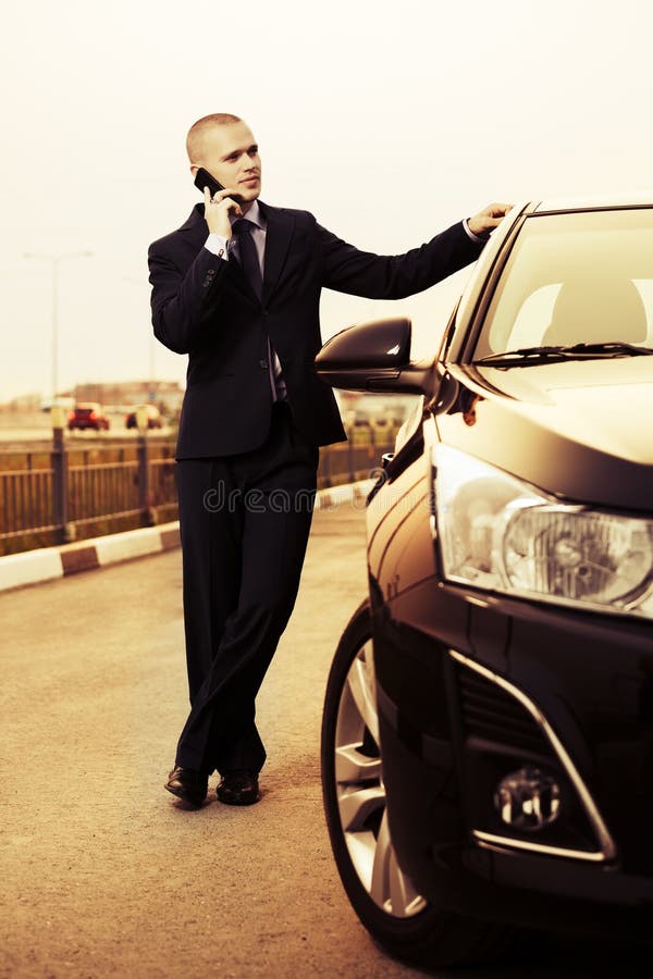 Limo Driver Standing Next To Opened Car Door with Red Carpet Stock ...