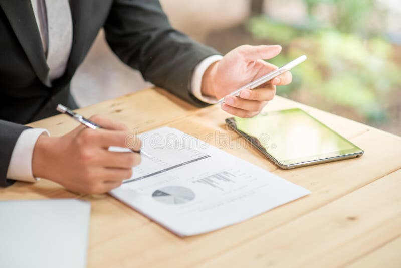 Business Man Checking Report and Using Smartphone Stock Photo - Image ...
