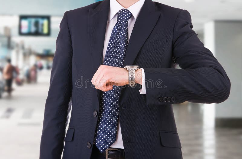 Businessman Checking Time on His Wristwatch. Stock Photo - Image of ...
