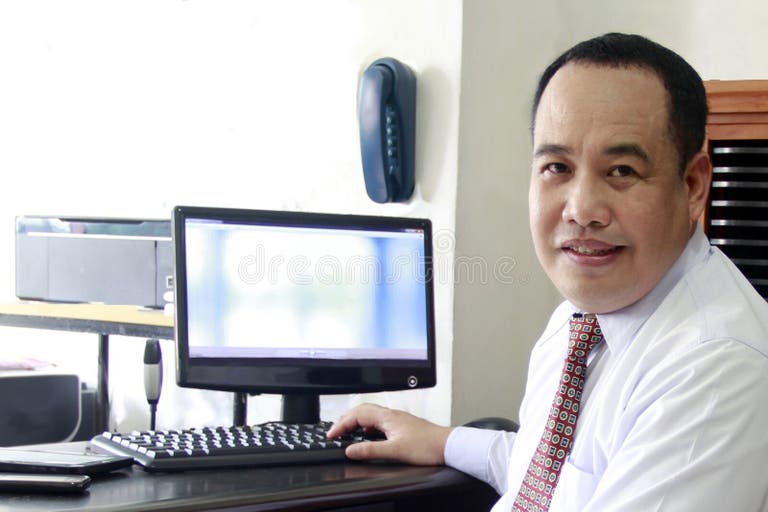 Business man on computer stock photo. Image of communication - 25005212