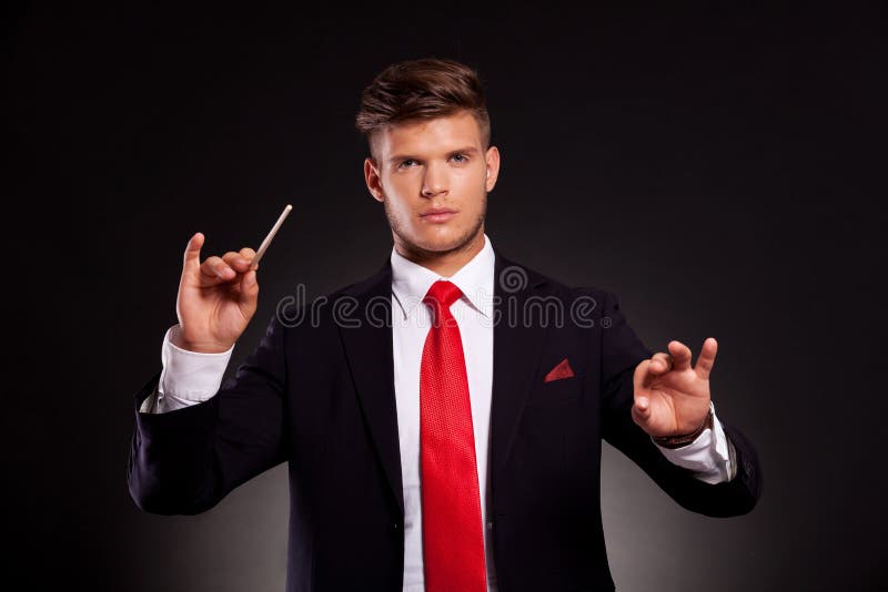 Young Orchestra Conductor Holding a Stick Stock Image - Image of ...
