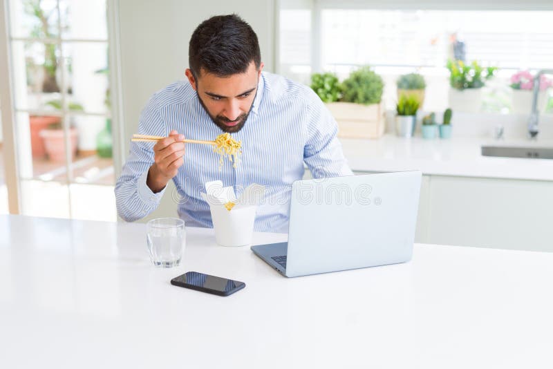 Business Man Eating Asian Food from Delivery while Working Using ...