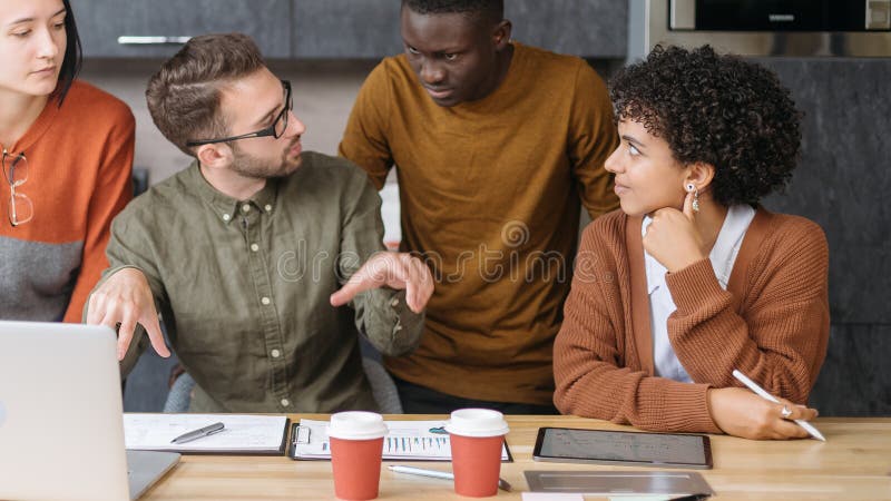 Business Man Explaining Something To His Colleagues . Stock Photo ...