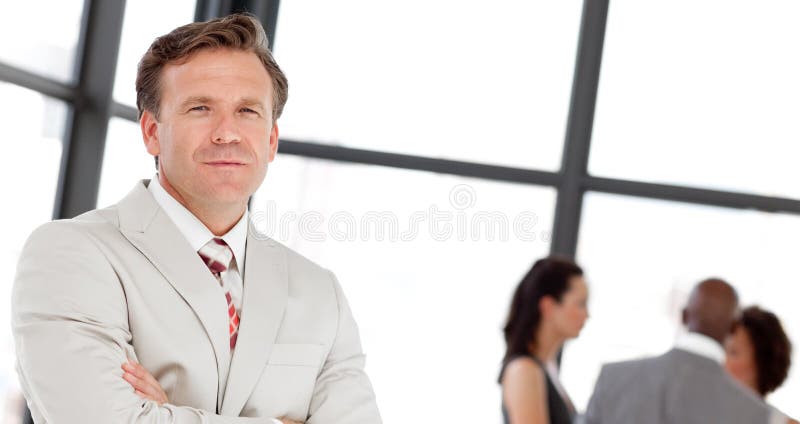 Business Man in Front of Team Stock Photo - Image of hispanic, business ...