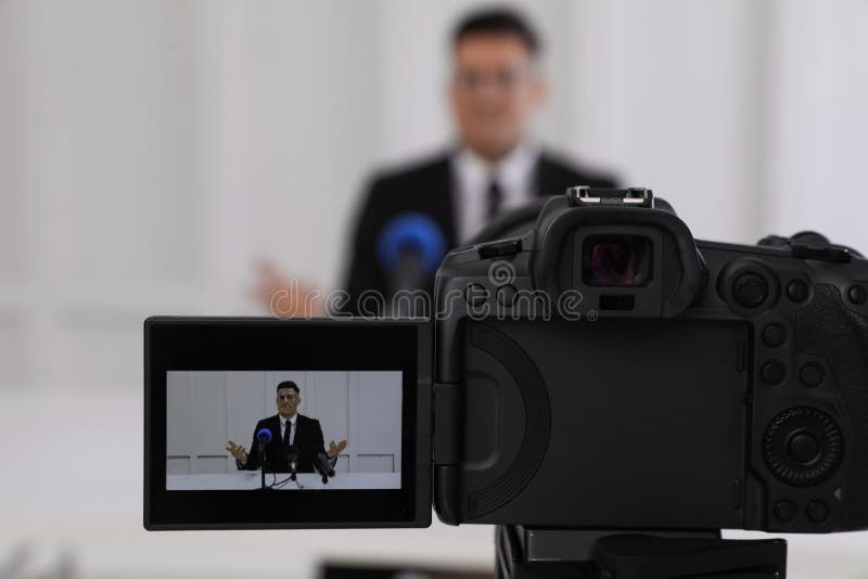 Business Man Giving Interview at Official Event, Focus on Video Camera ...