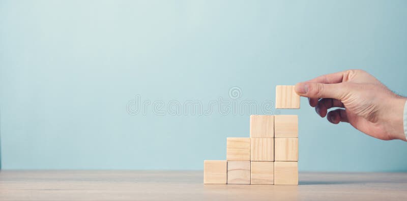 Man Hand Holding Wooden Blocks Stock Photo - Image of development ...