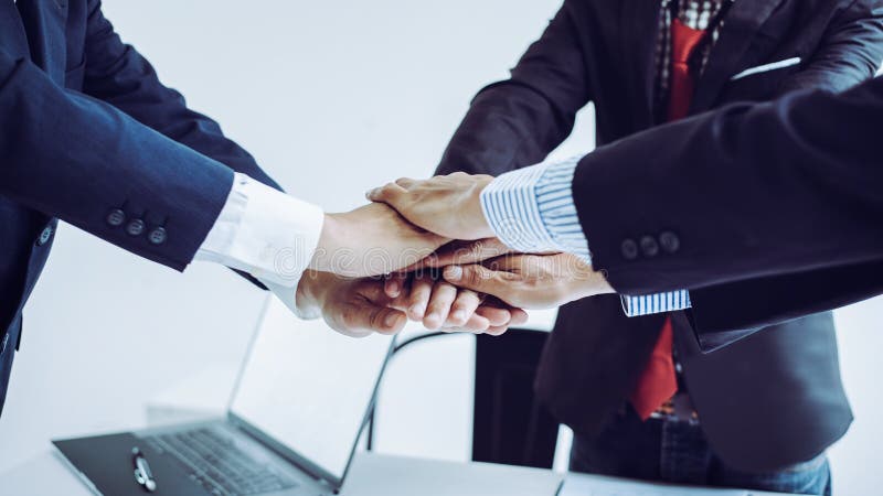 Business Man Hand Joined Team in the Office with Colleagues Stock Photo ...