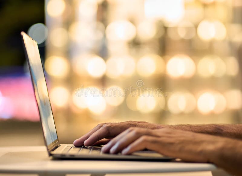 Business Man Hands Typing on Laptop Keyboard on Night Lights Background ... Business Man Hands Typing on Laptop Keyboard on Night Lights Background ...
