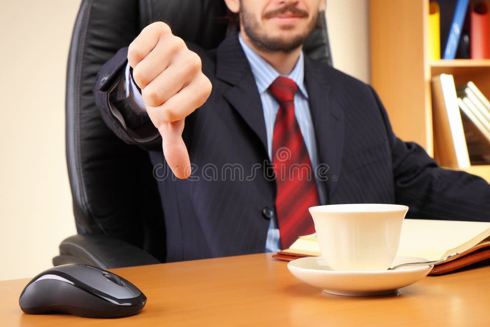 Business Man at His Workplace Shows Thumb Down Stock Photo - Image of ...