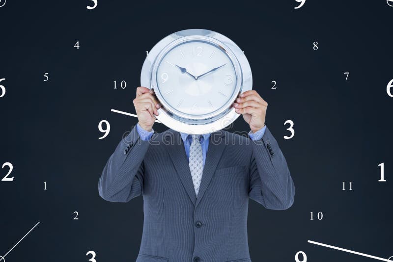 Business Man Holding a Clock Against Background with Clocks Stock Photo ...