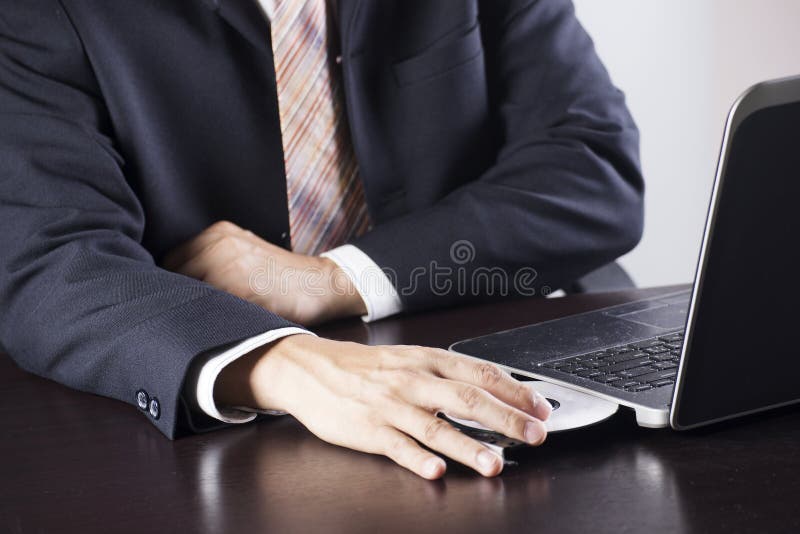 Business Man Holding Disk Insert To Laptop Stock Image - Image of ...