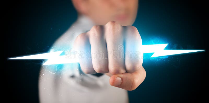 Business Man Holding Glowing Lightning Bolt In His Hands Stock Photo ...