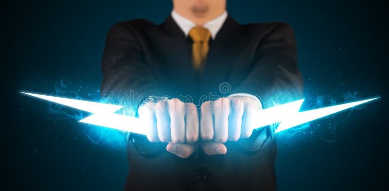 Business Man Holding Glowing Lightning Bolt in His Hands Stock Photo ...