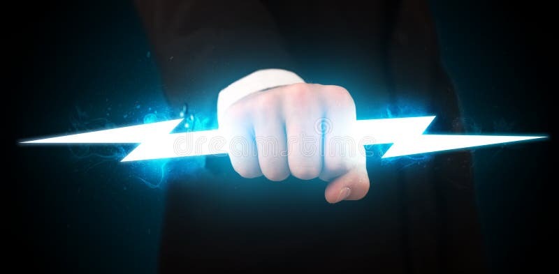Business Man Holding Glowing Lightning Bolt in His Hands Stock Image ...
