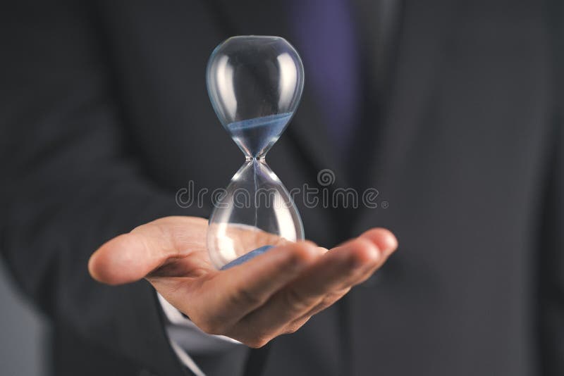 Business Man Holding Hourglass in Hand Stock Photo - Image of date ...