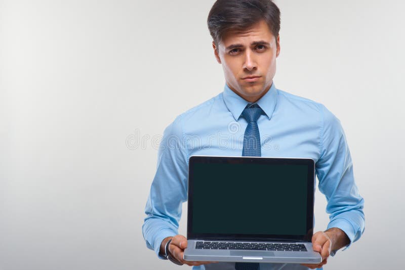Business Man Holding a Laptop Against a White Background Stock Photo ...