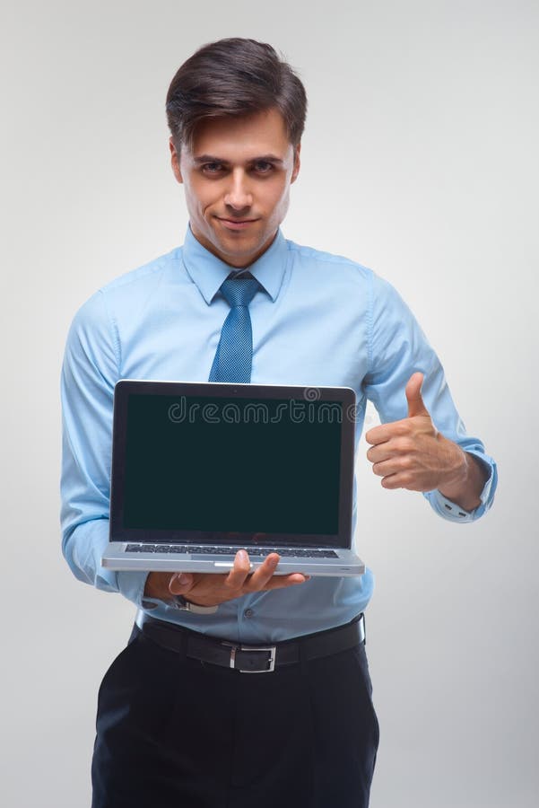 Business Man Holding a Laptop Against a White Background Stock Photo ...