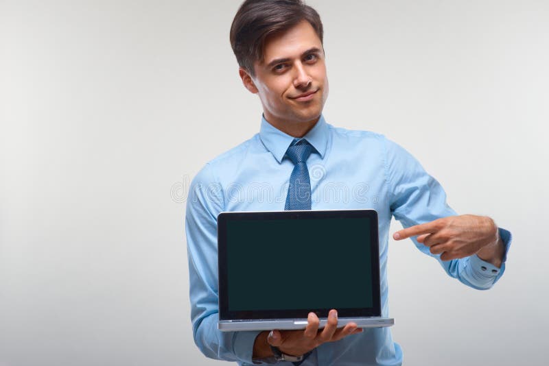 Business Man Holding a Laptop Against a White Background Stock Image ...