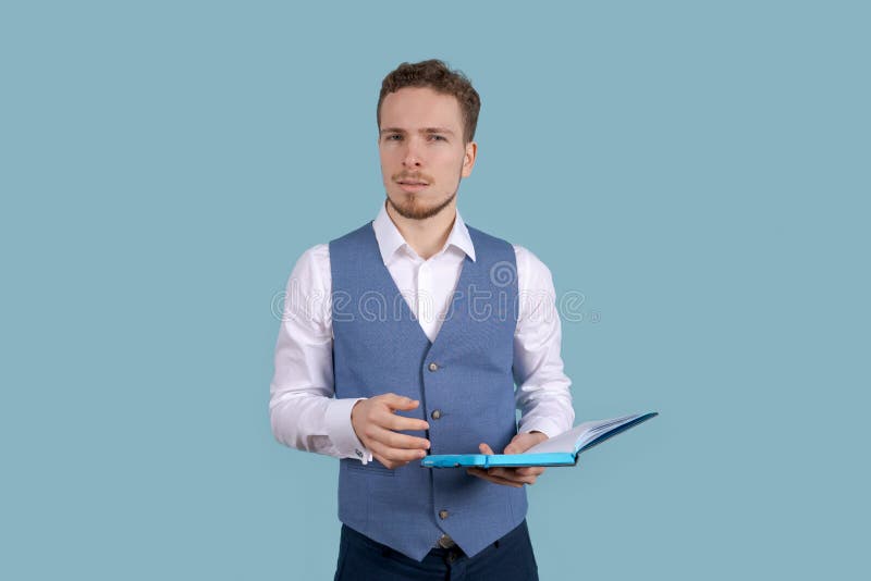 Business Man Holding Notepad for Writing in Suit on Blue Background in ...