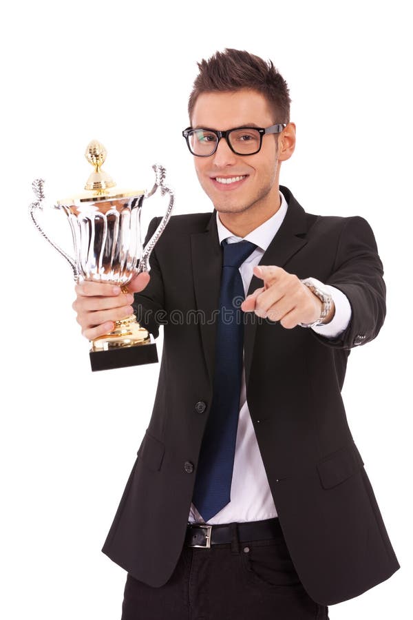 Business Man Holding a Trophy and Pointing Stock Photo - Image of ...