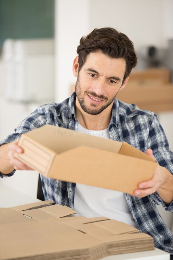 Business man making boxes stock photo. Image of courier - 317246886