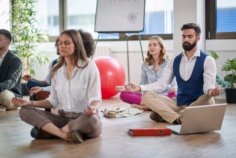 Business Man Meditating at Work.group of Business Coworkers Meditating ...