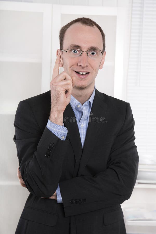 Business Man at Office Holding Finger Up: Idea or Warning. Stock Photo ...