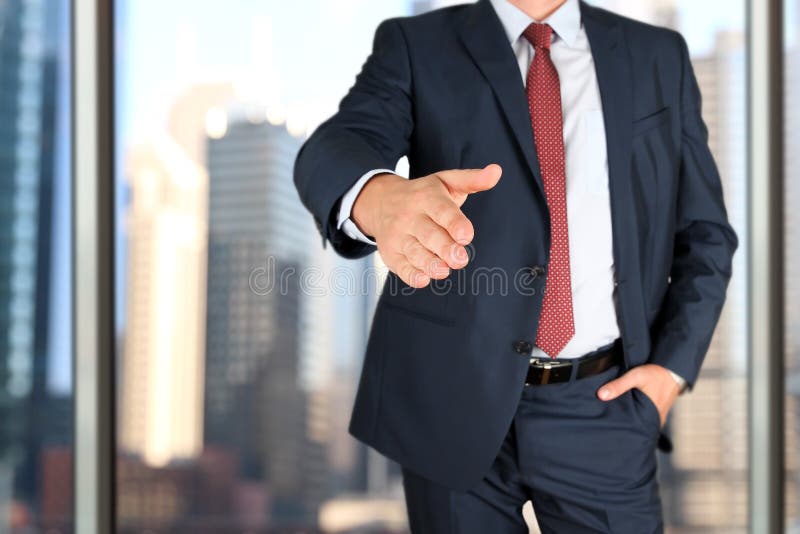 A Business Man with an Open Hand Extended To Handshake Stock Photo ...