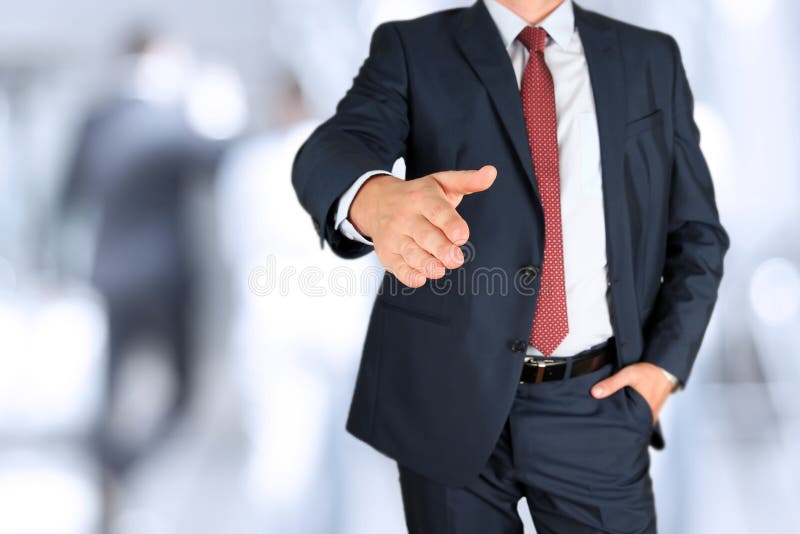 A Business Man with an Open Hand Extended To Handshake Stock Image ...