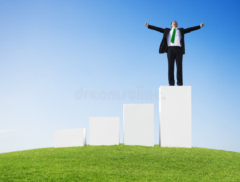 Business Man Outdoors Standing on a Bar Graph with Arms Raised Stock ...