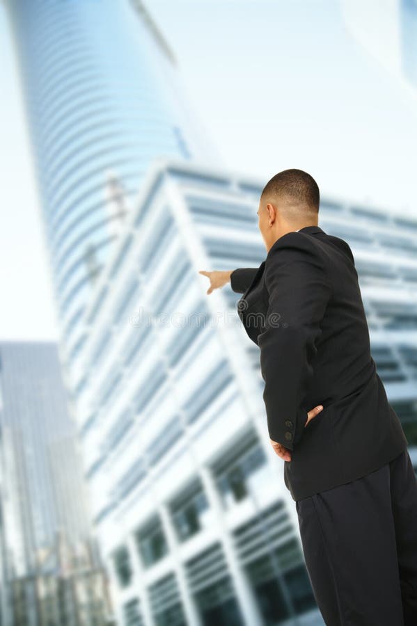 Business Man Pointing At Building Stock Photo - Image of professional ...