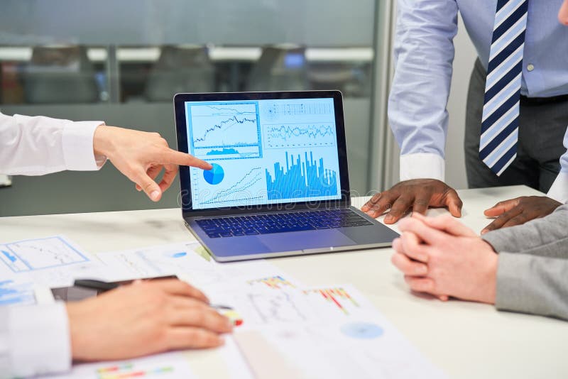 Business Man Pointing at Graph on Laptop Computer Stock Image - Image ...