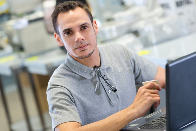 Business Man Posing Typing on Computer in Warehouse Stock Image - Image ...