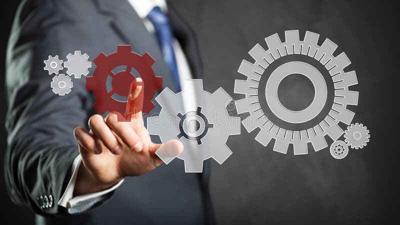 Business Man Pressing a Specific Cog Wheel Stock Image - Image of ...